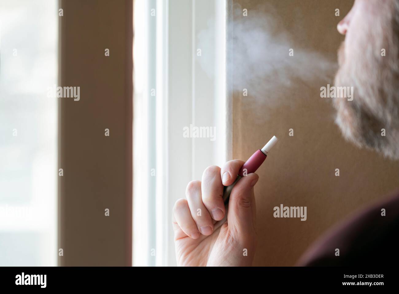 Smoking man at the window hi-res stock photography and images - Alamy