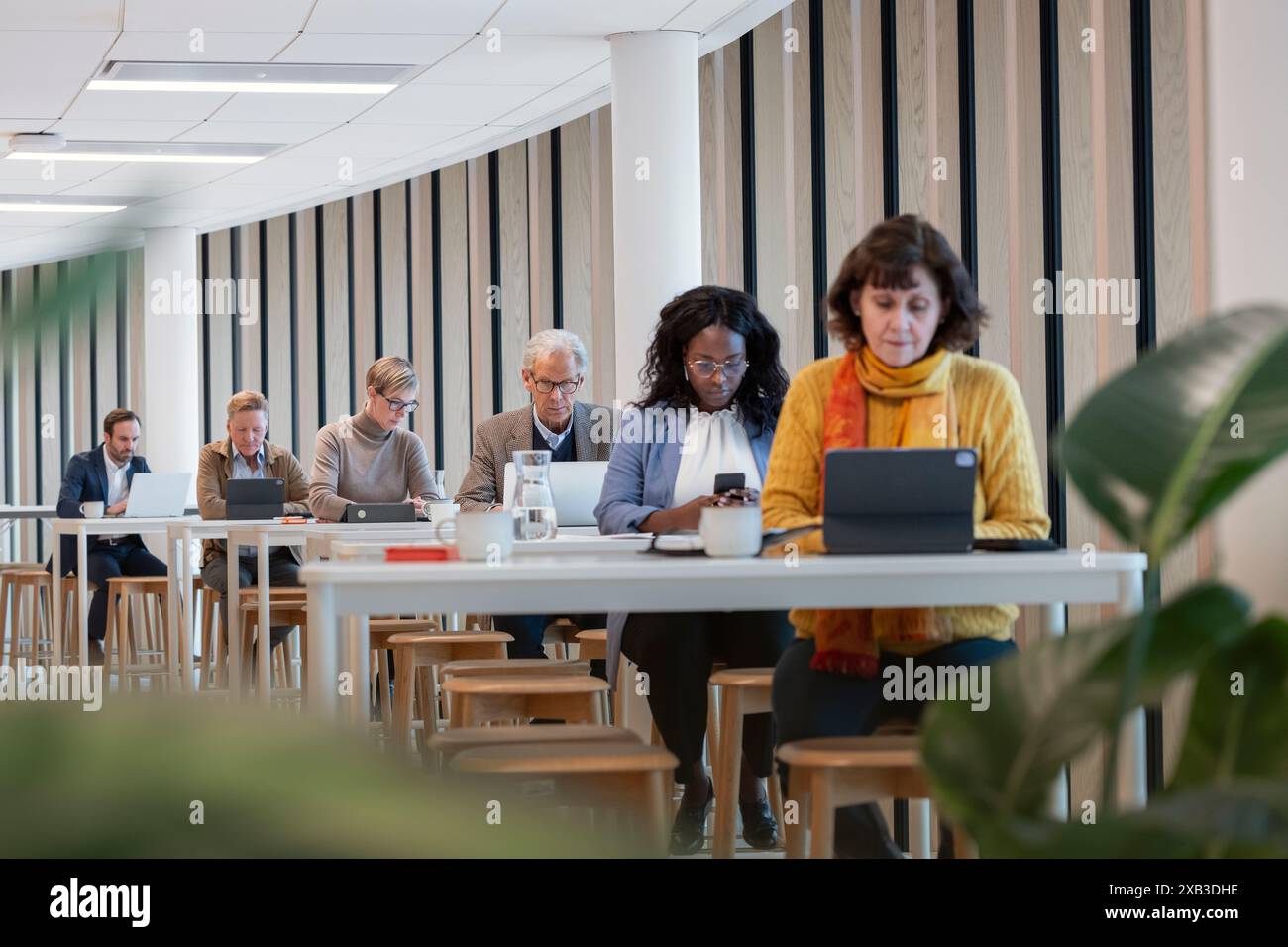 Multiracial colleagues using technologies hi-res stock photography and ...