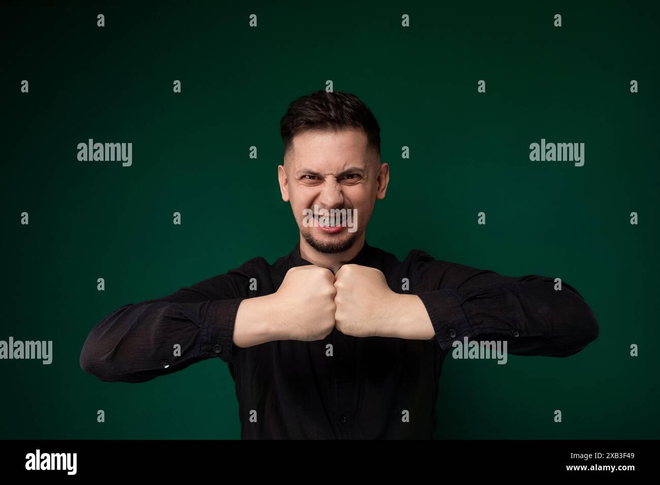 Man Making Fist Gesture With Hands Stock Photo - Alamy