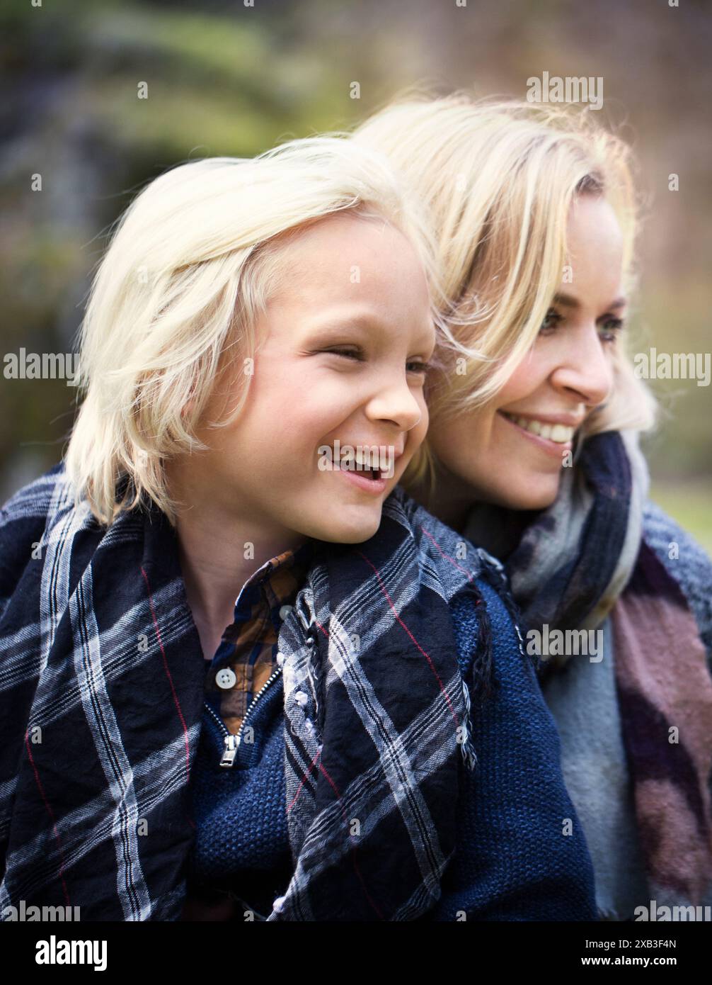 Happy blond boy with mother Stock Photo - Alamy