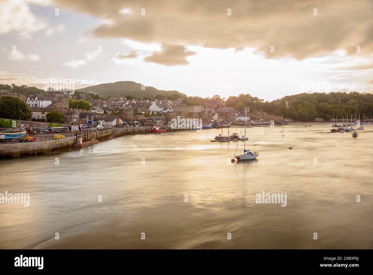 View of the town of Conwy and the harbour at sunset in summer Stock ...