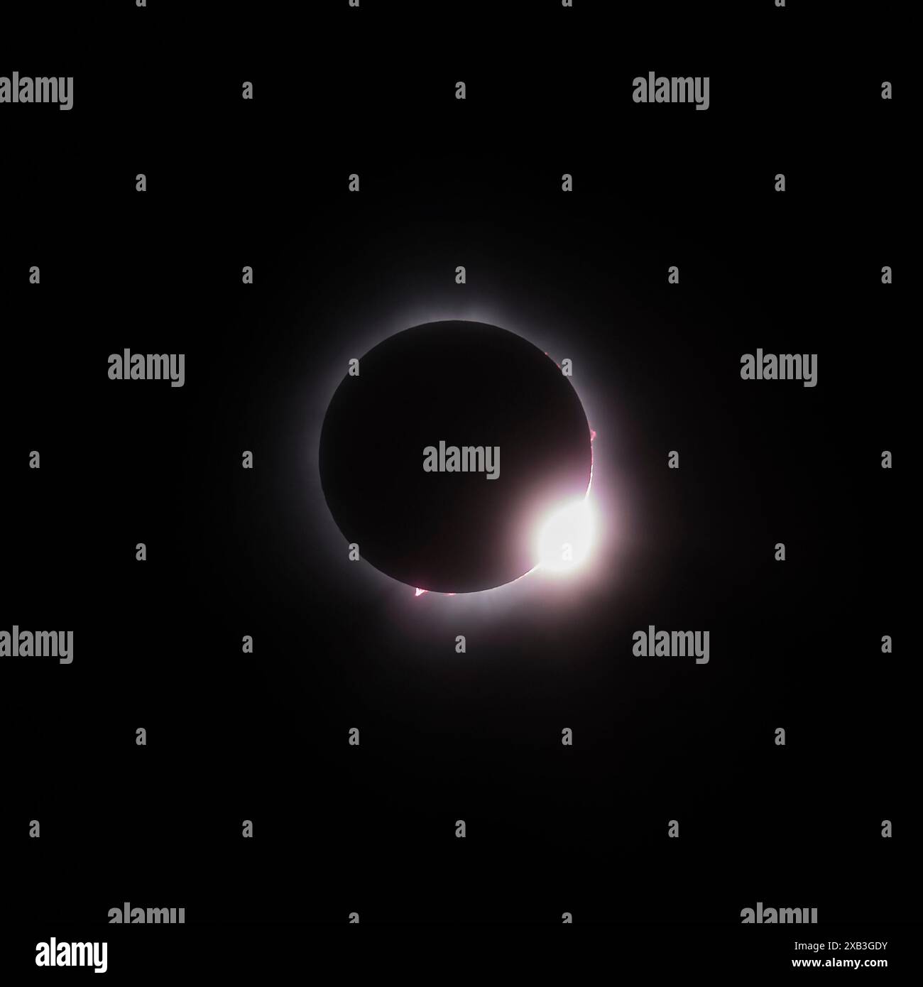 The total solar eclipse just as the sun begins to appear looks like a ...