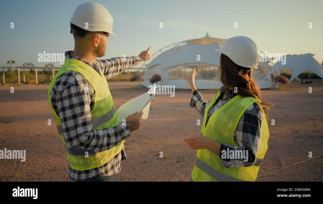 Caucasian professional engineers woman female girl discuss guy man male ...