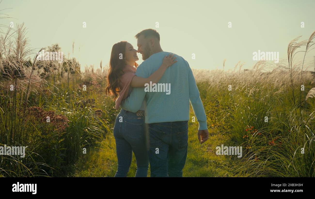 Back view happy family Caucasian married couple loving man kissing ... Back view happy family Caucasian married couple loving man kissing ...