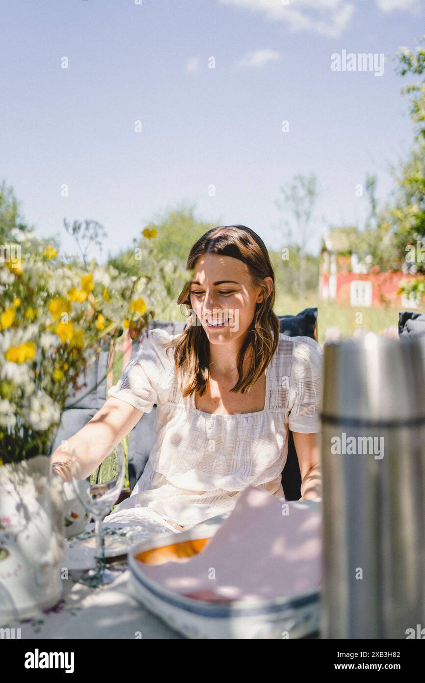 Young woman sitting dining table hi-res stock photography and images ...