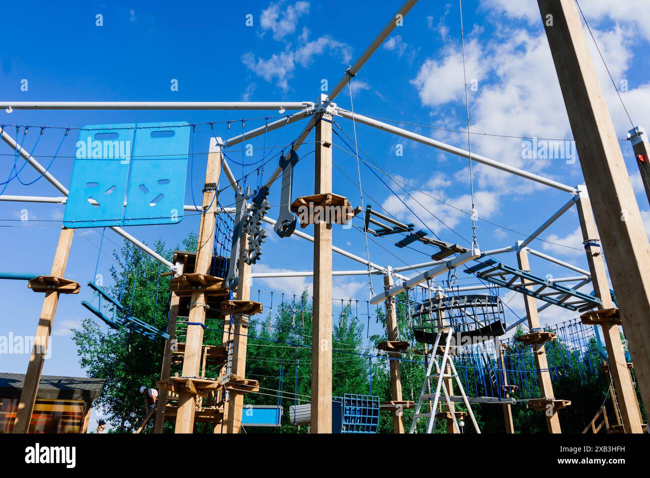 On high pines various equipment for sports - ropes, slings, wooden ...