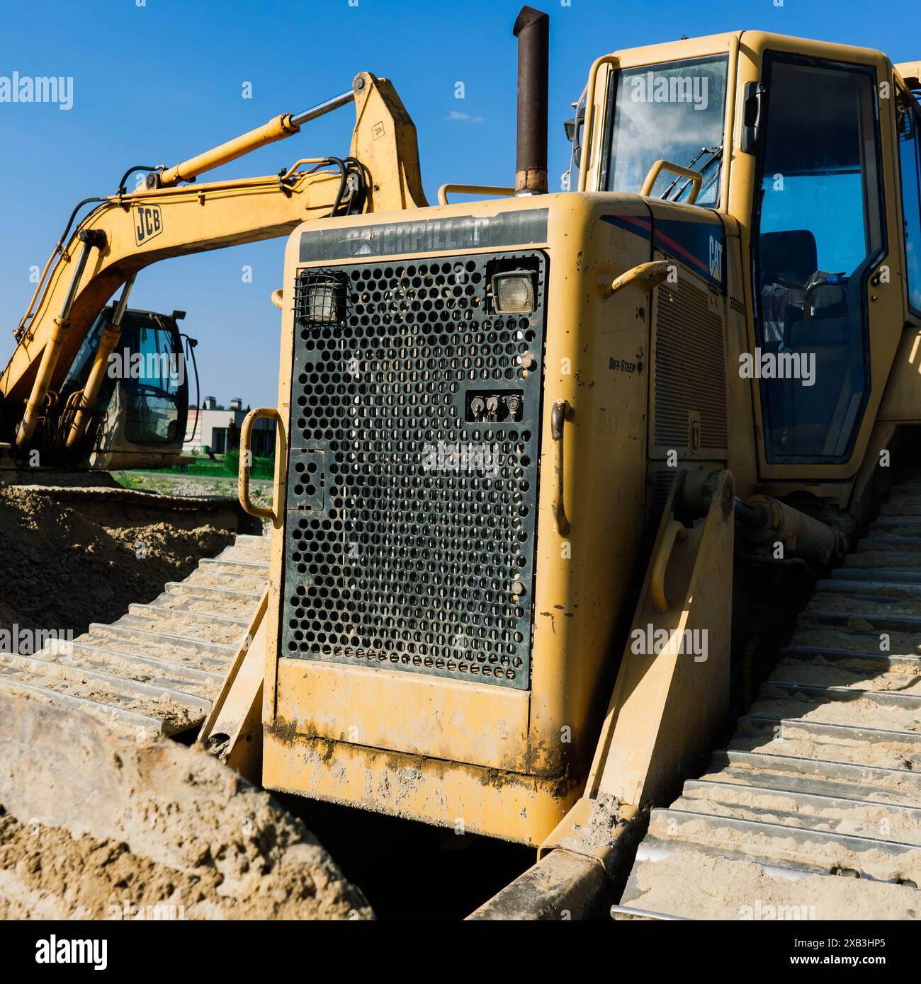 Excavator in a quarry extracting stone, soil ground Stock Photo - Alamy