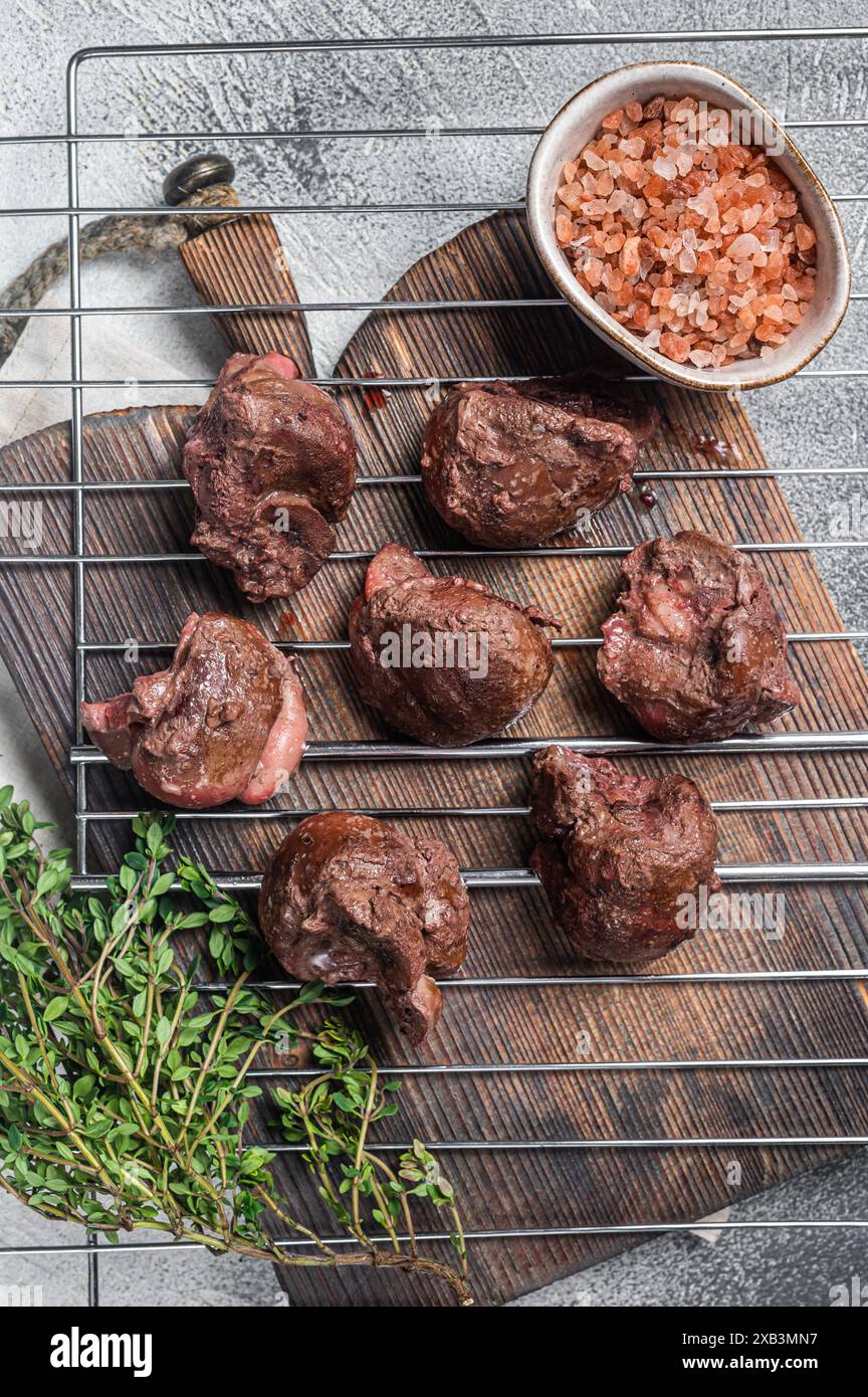 BBQ Grilled lamb mutton kidney, offal meat on grill. White background ...