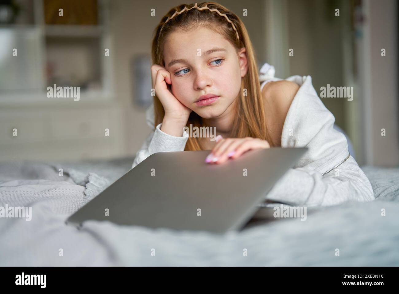 Unhappy Teenage Girl Closing Laptop Lying On Bed At Home Anxious About ...