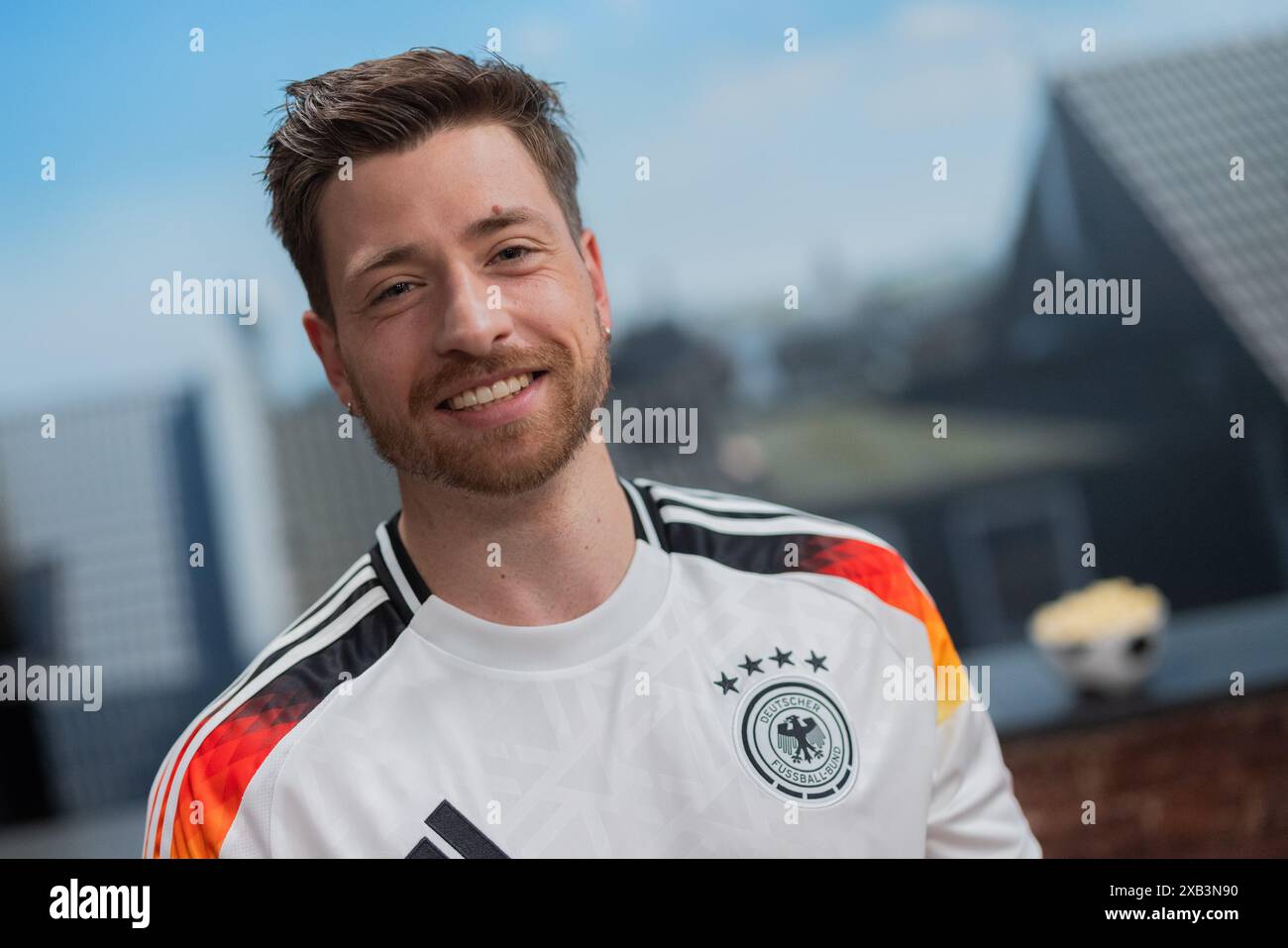 Cologne, Germany. 10th June, 2024. Dominik Flade, actor, stands at a ...