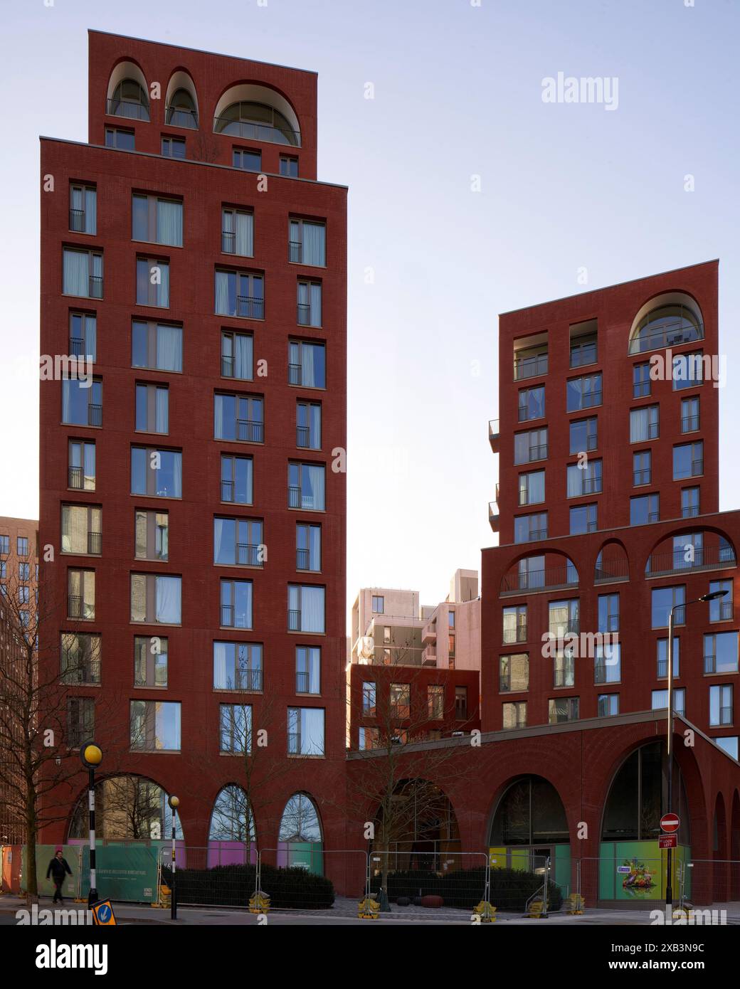 Red brick facade and arches of ground level from north. Cadence - King ...