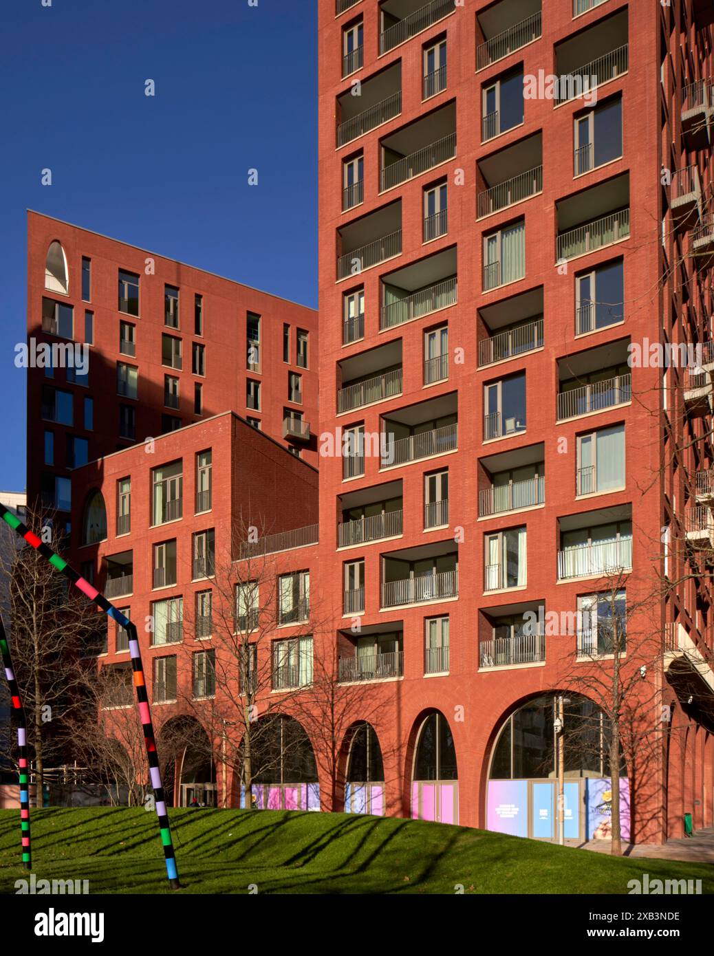 Red brick facade and arches of ground level. Cadence - King's Cross ...