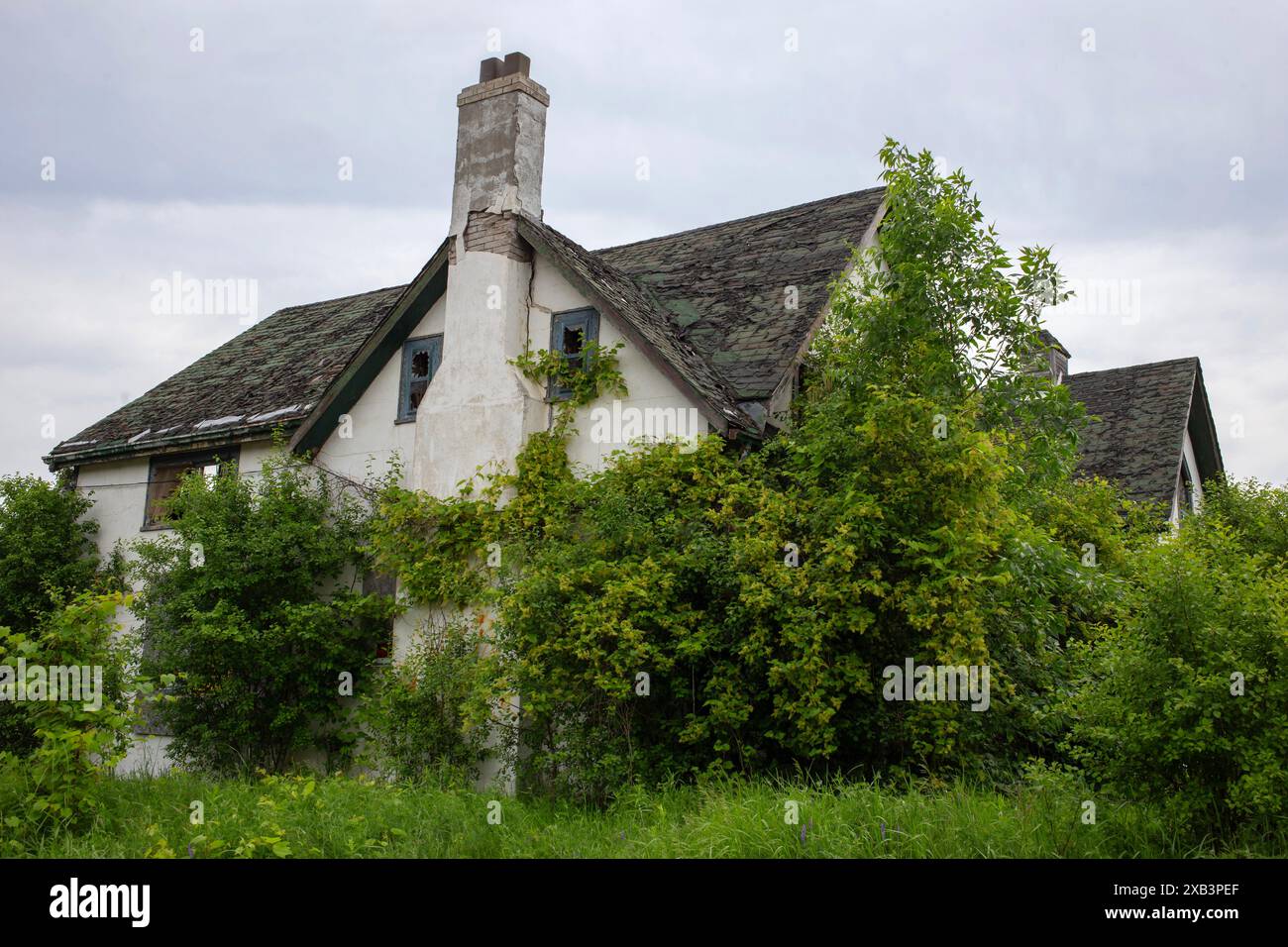 Old abandoned two story house Stock Photo - Alamy