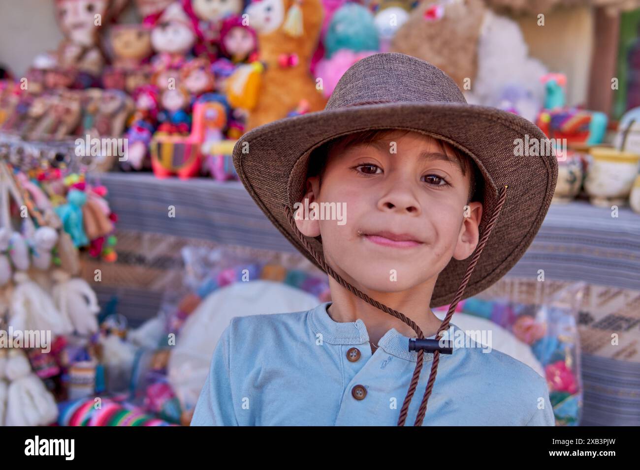 Portrait Of Latin Tourist Boy With Hat Looking Happily At The Camera 6149