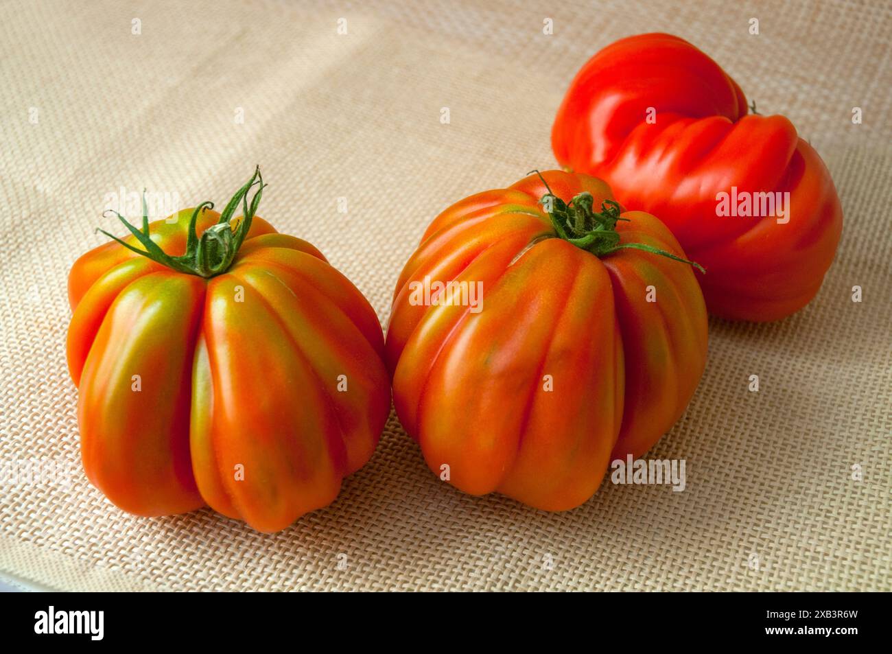 Three raf tomatoes. Close view Stock Photo - Alamy