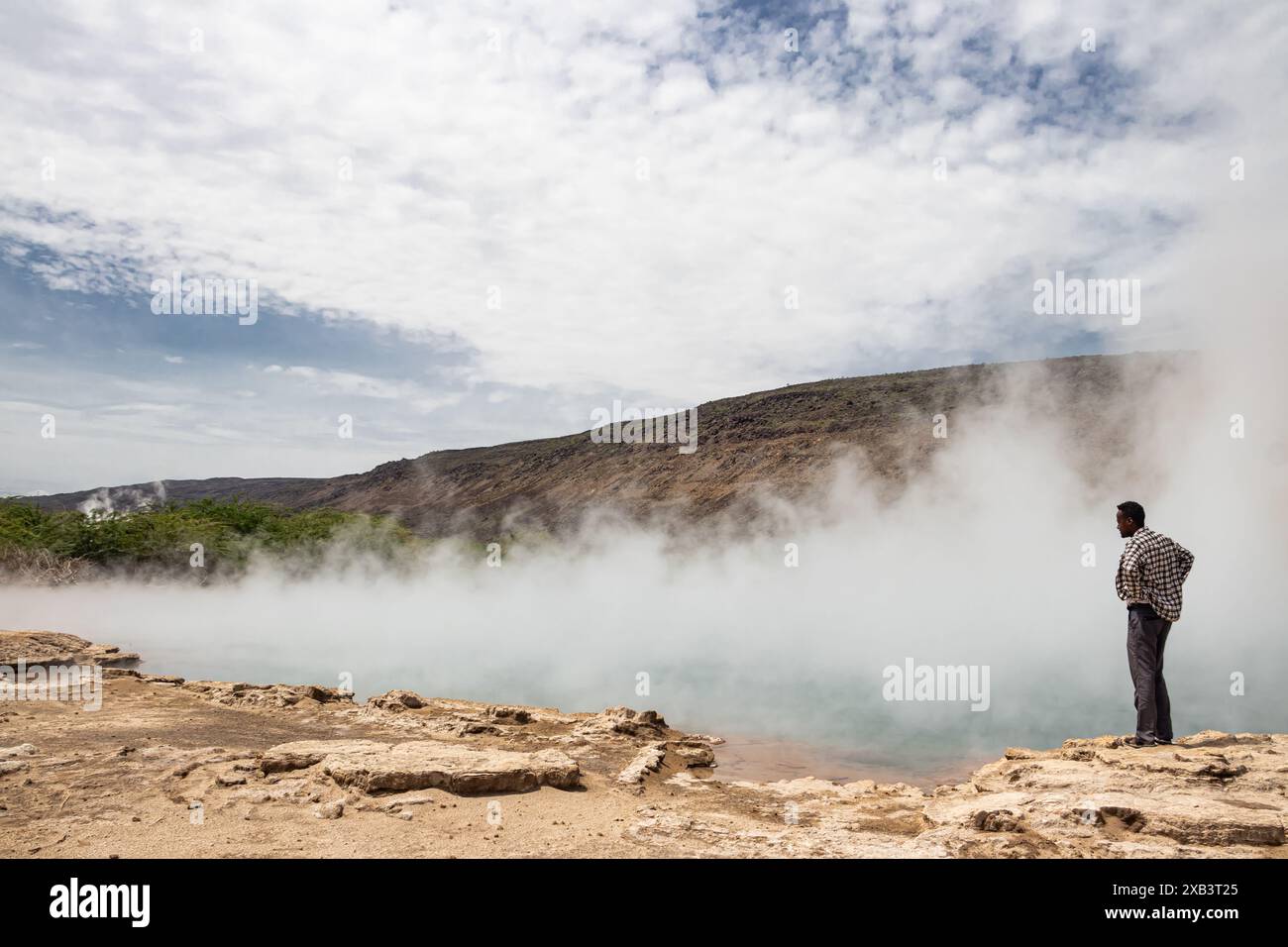 Tour guide in Alolabad, Ethiopia, showing hot geothermal volcanic ...
