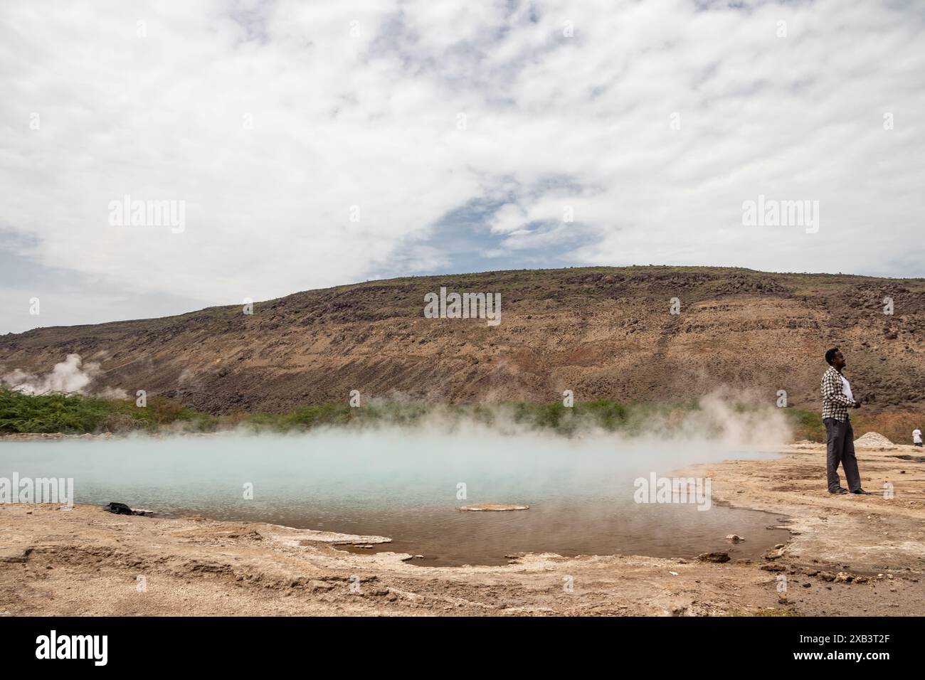 Tour guide in Alolabad, Ethiopia, showing hot geothermal volcanic ...