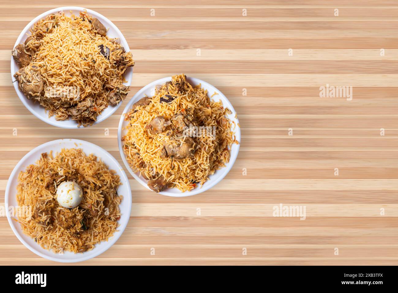 Indian famous biryani dishes on white plate. Chicken biryani, mutton ...