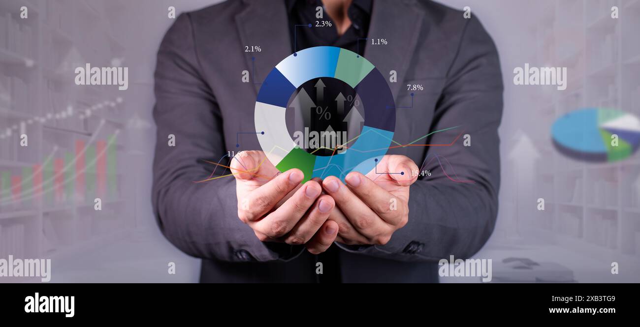 businessman holds pie chart of business investment growth Stock Photo ...