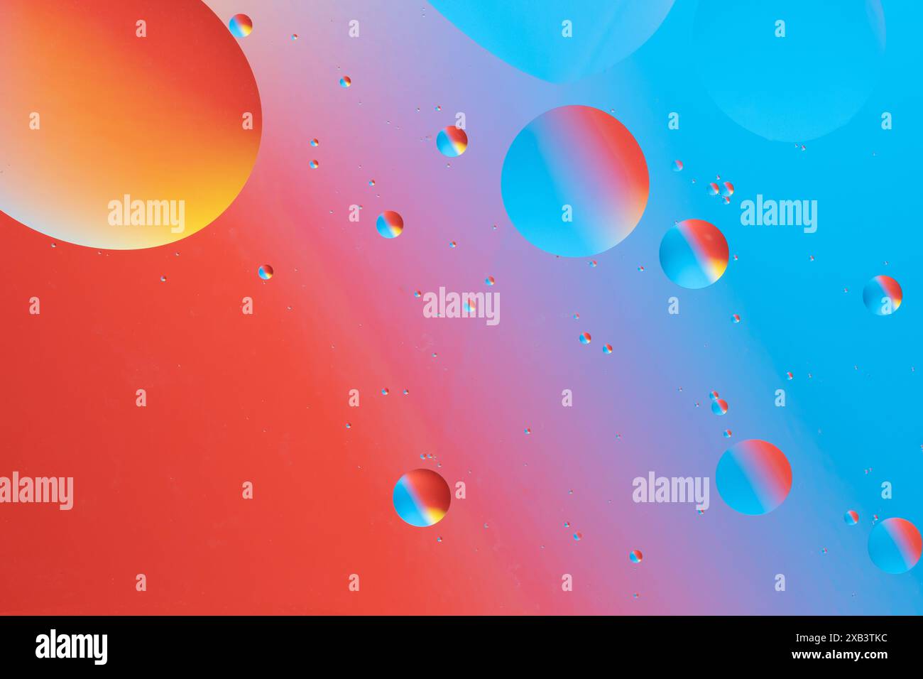 Abstract art featuring vibrant red and blue with bubble like shapes ...