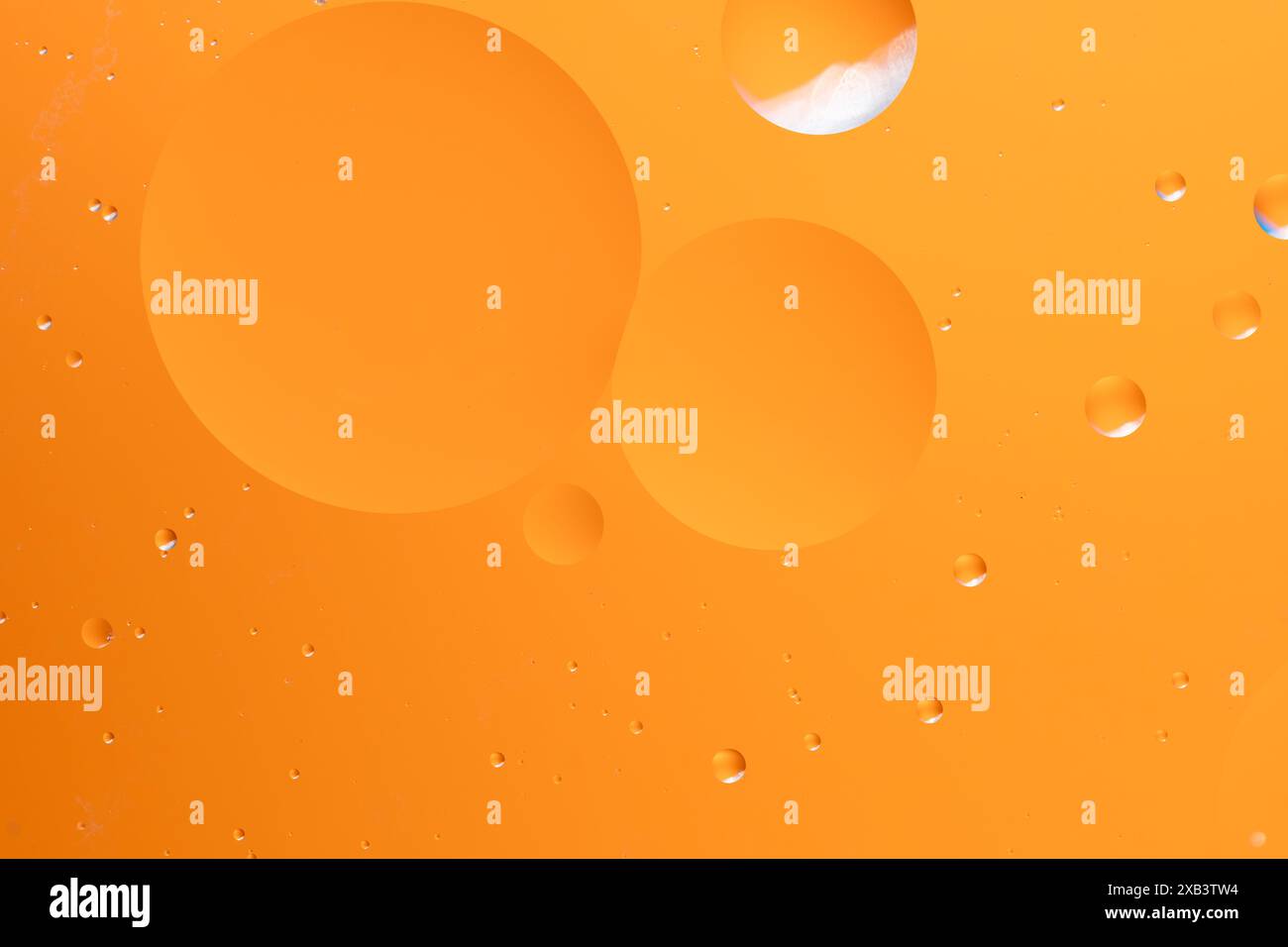 Abstract background with large and small circular shapes in orange ...