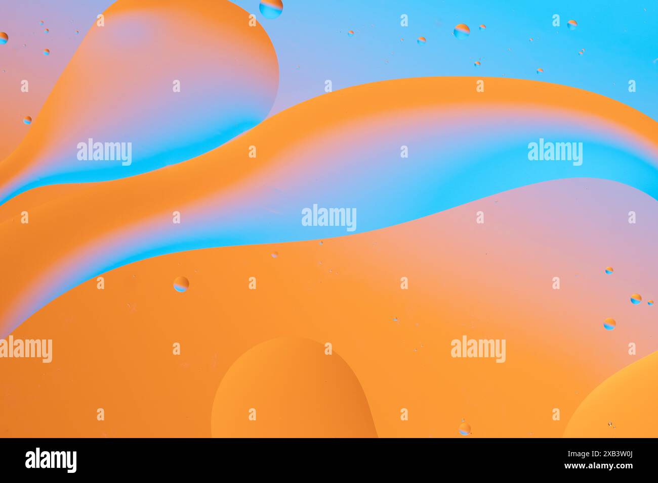 Dynamic fluid shapes in orange and blue gradients create a vibrant and smooth abstract pattern ...