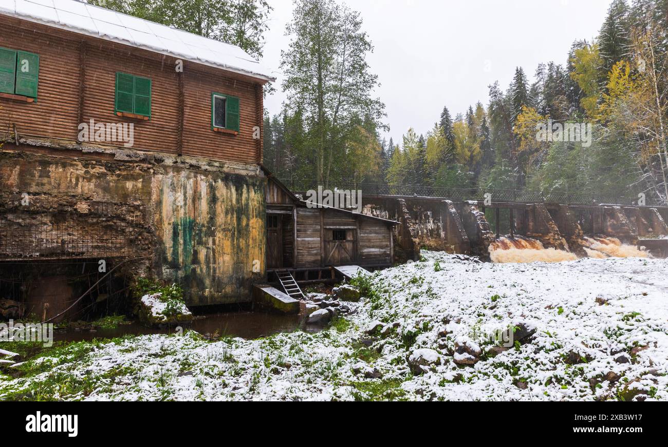 Winter landscape with Old Finnish hydroelectric plant at Volchya river ...