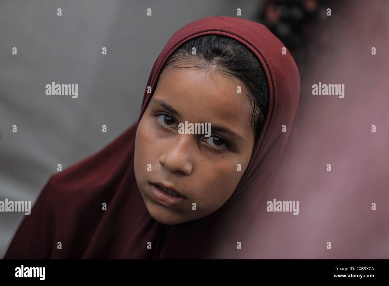 Displaced Palestinian children gather around a makeshift cube ...