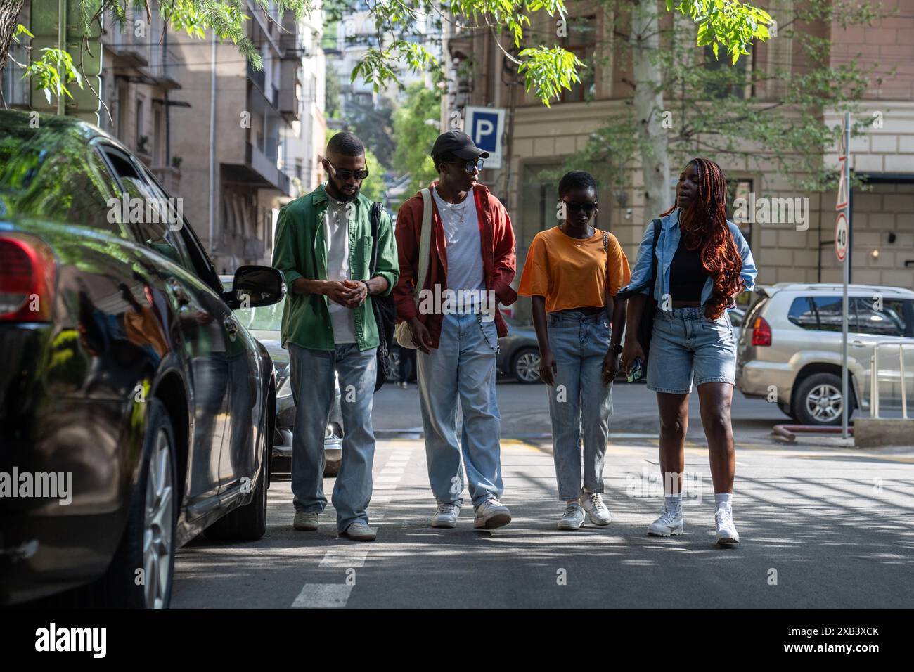Friendly company of thoughtful black friends students buddies walking ...