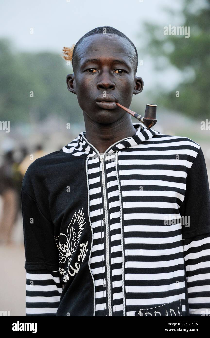 SOUTH SUDAN, Lakes state, town Rumbek, Dinka tribe, man in faked Prada ...