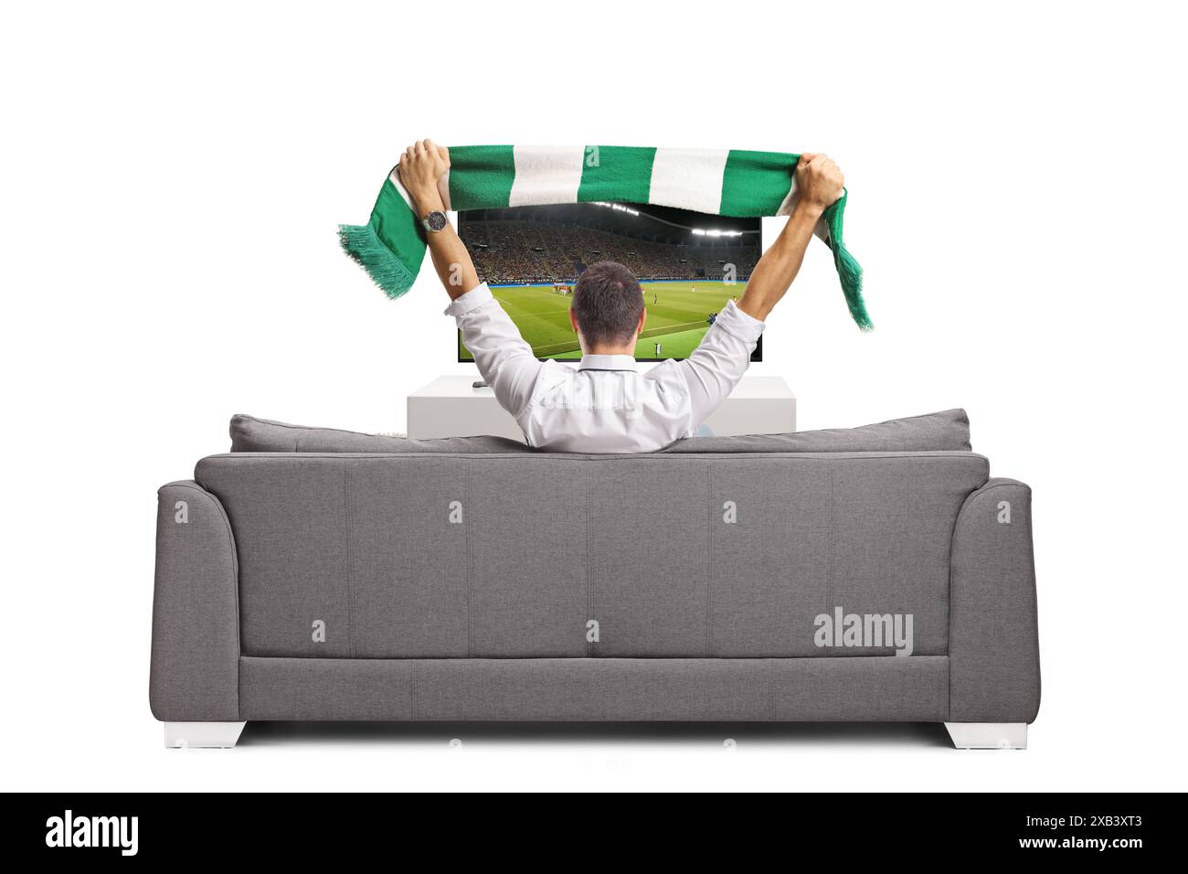 Back view of a man cheering with a scarf in front of a tv screen with ...