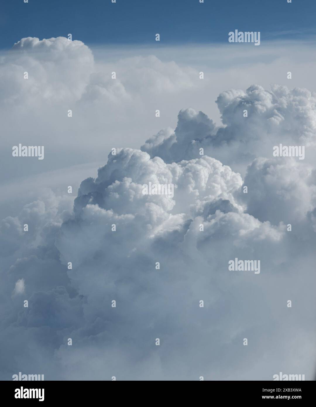 View of big clouds seen from the airplane window seat Stock Photo - Alamy