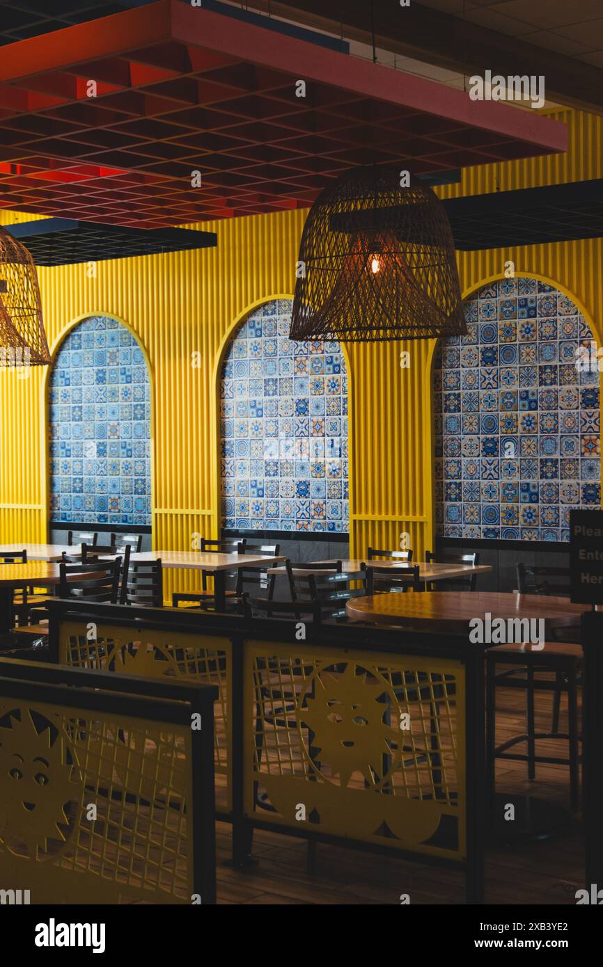 Brightly colored restaurant decor, with red and black ceiling, yellow ...