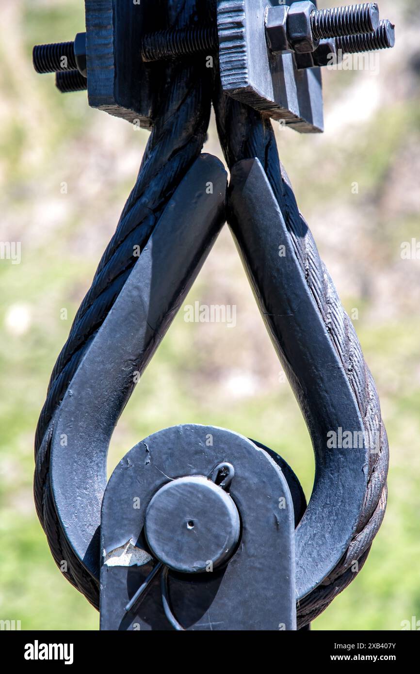 Steel cable and rope fastening system with iron loop and hook. Bridge ...