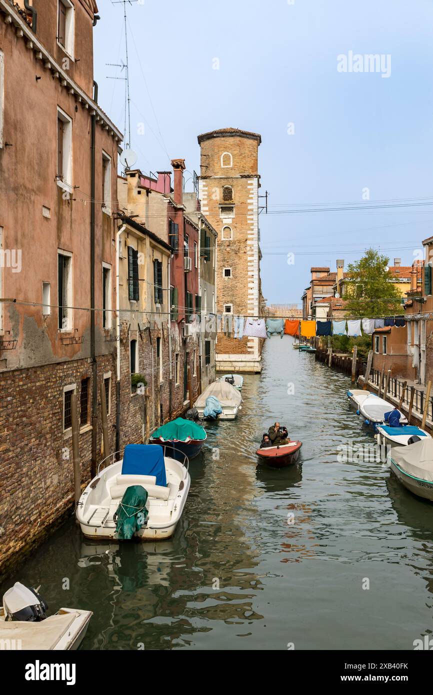 Venice Italy, urban, canal setting, boats and gondolas in the waterway ...