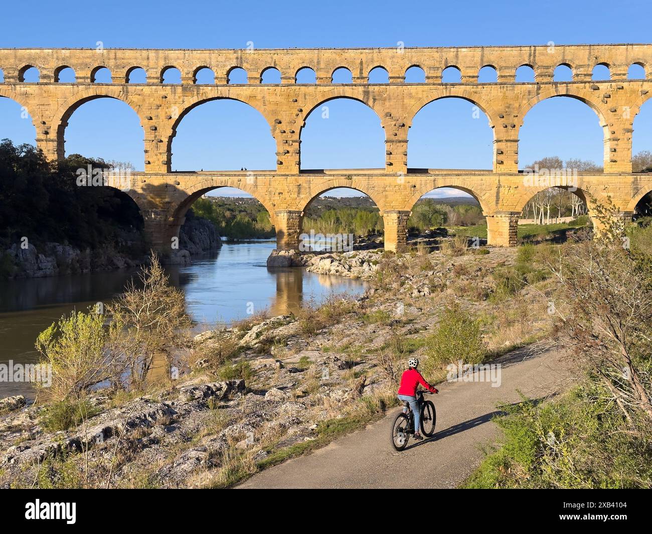 senior woman mountainbiking with her electric bike below the famous ...