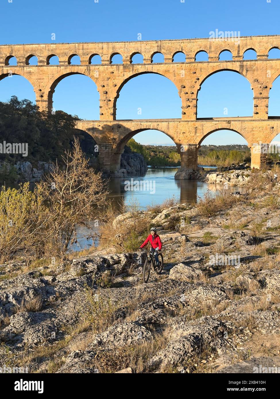 senior woman mountainbiking with her electric bike below the famous ...