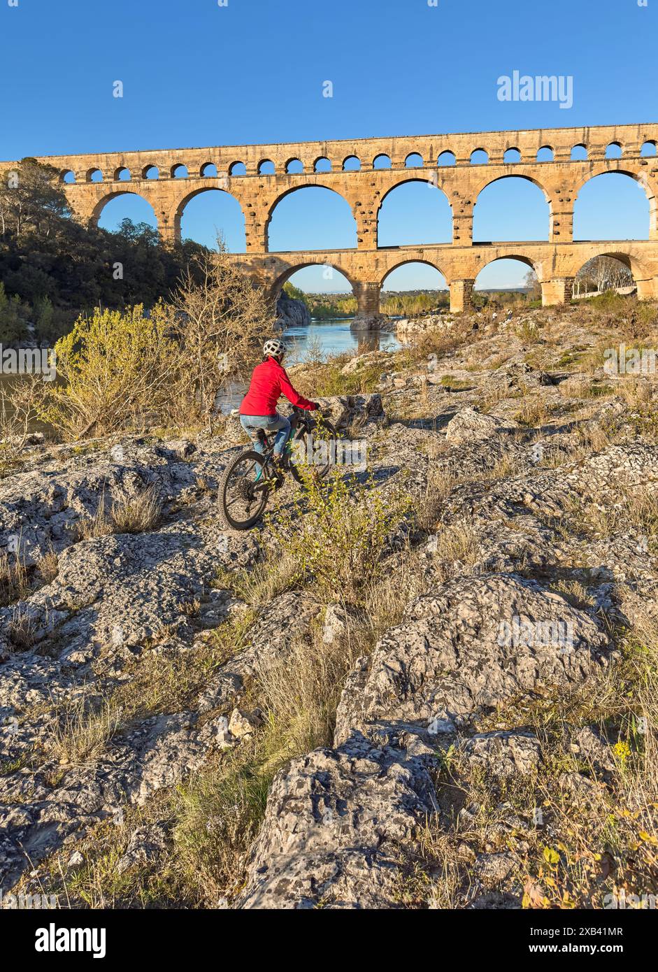 senior woman mountainbiking with her electric bike below the famous ...