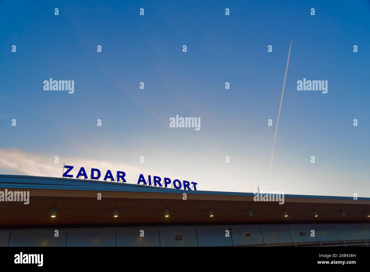 Sign Zadar Airport on the roof of the international airport at dusk ...