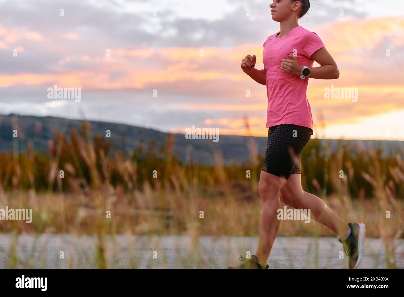 Determined Athlete Running in the Sun amidst Beautiful Nature Stock ...