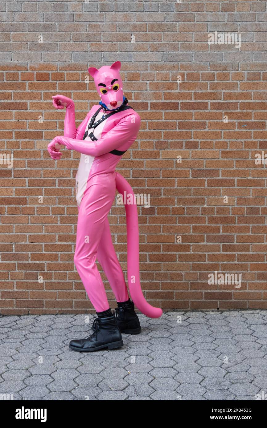Portrait of a gender fluid non binary man dressed as the Pink Panther ...