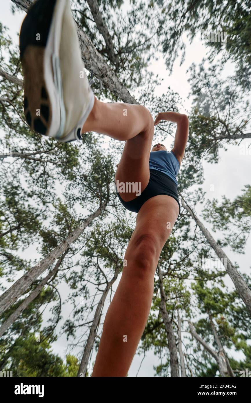 Adventurous Woman Overcoming Forest Obstacles with Determination and ...