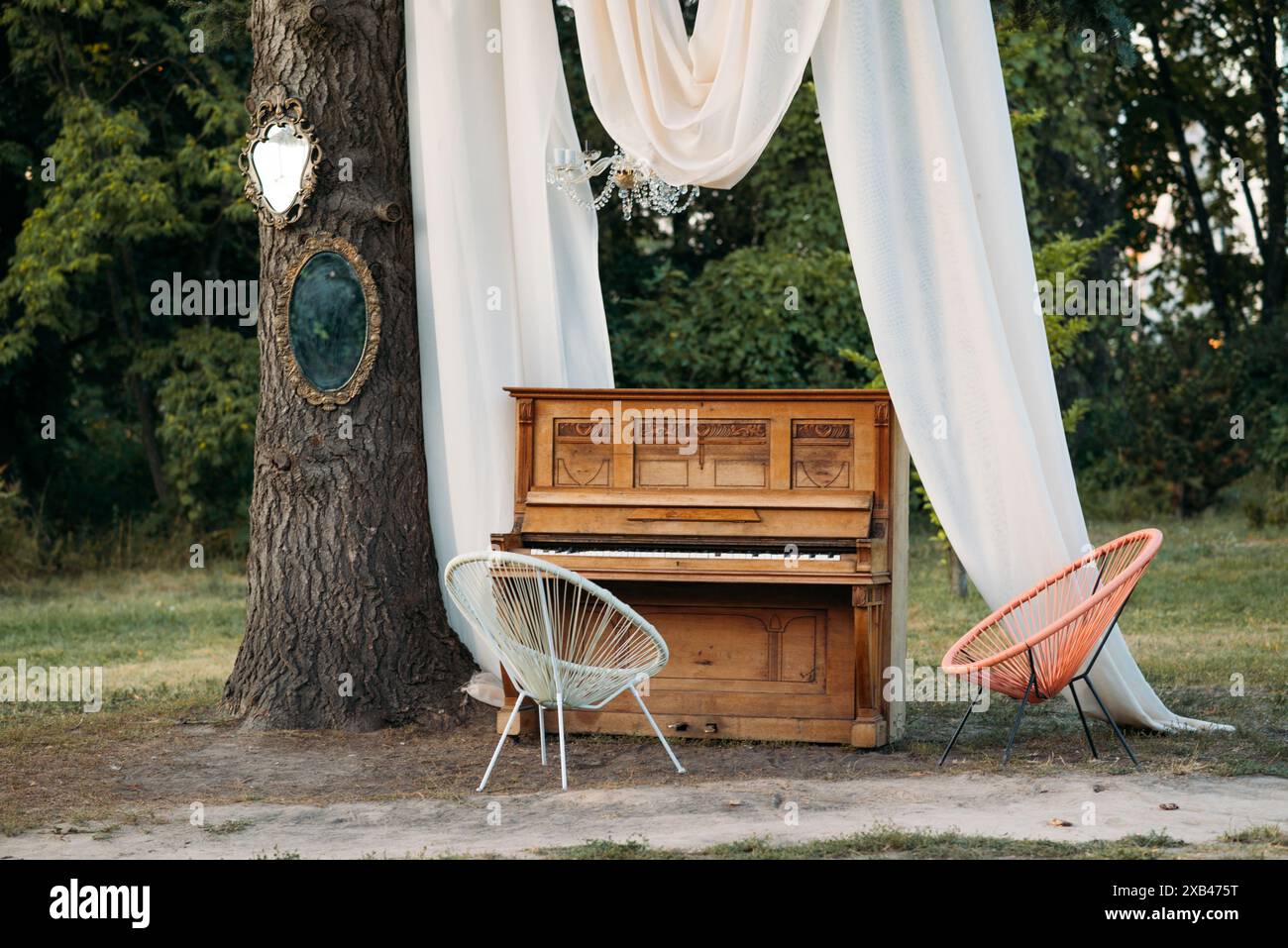 piano and chair with romantic decor in summer in garden. Decor for a ...