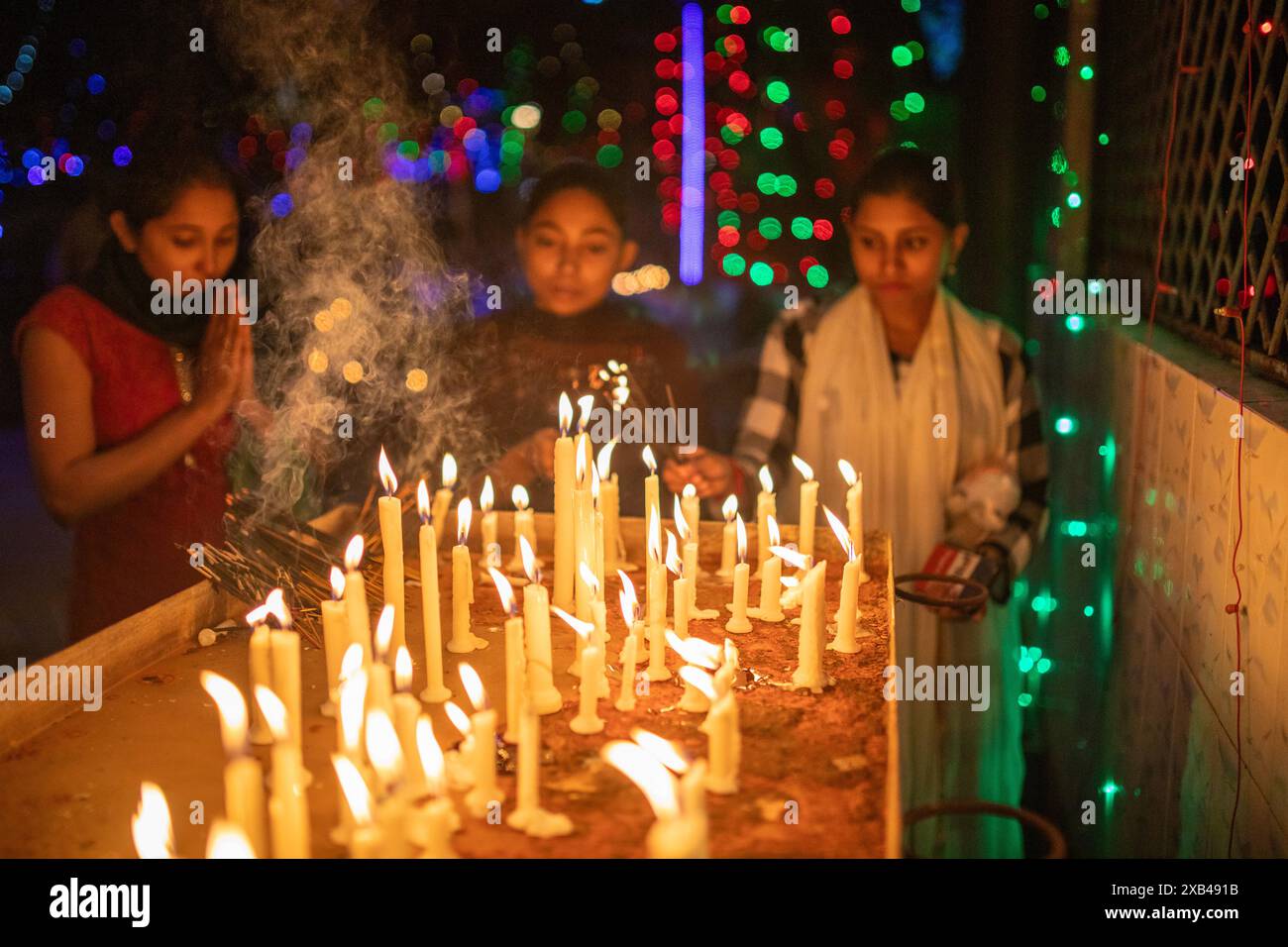 Devotees lit candles at the Sri Sri Baradeswari Kalimata Temple at ...