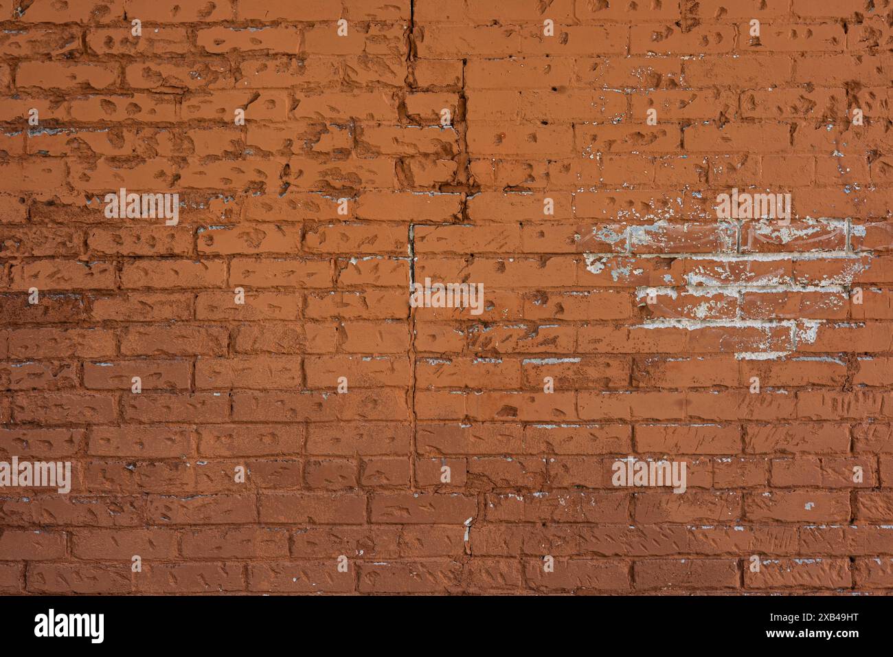 Red brick wall with cracks and repair Stock Photo - Alamy