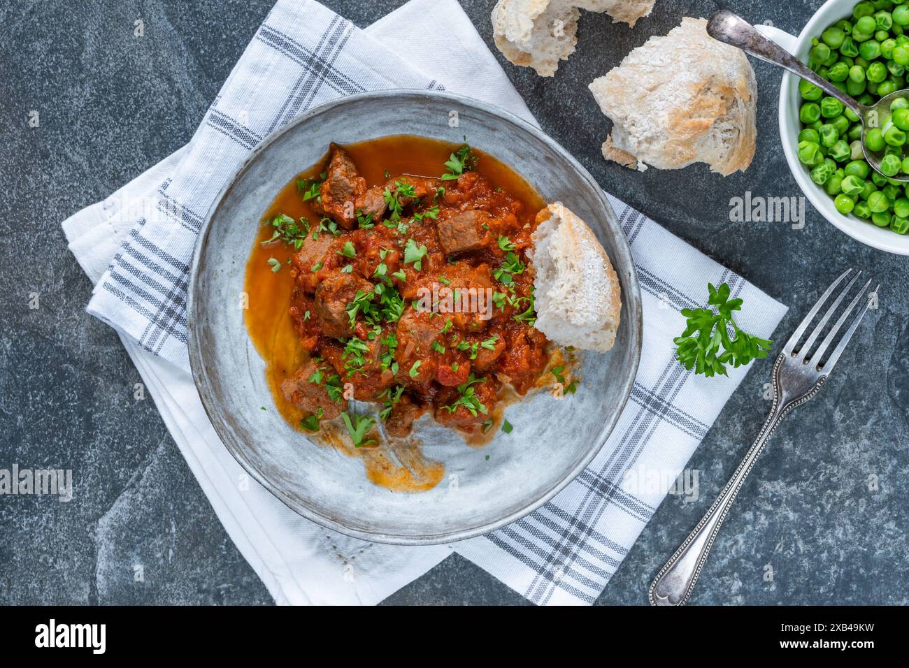 Braised beef stew in red wine and tomato sauce Stock Photo - Alamy