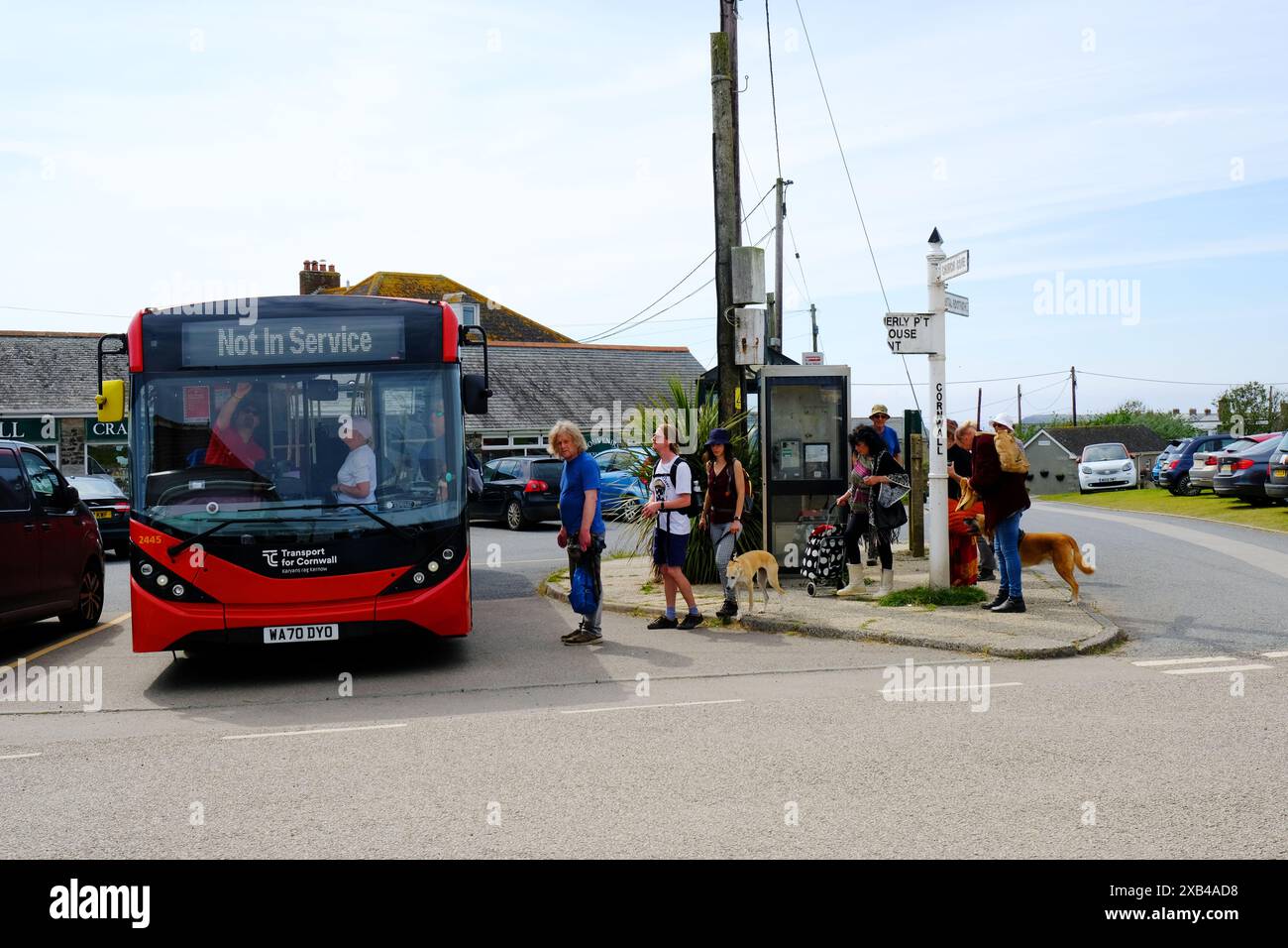 Local bus service picking up tourists, the Lizard Village, Cornwall, UK ...