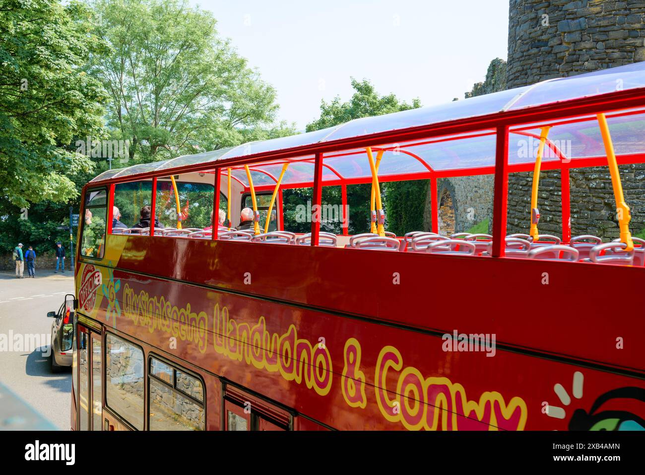 Conwy Wales UK 06-01-2024. Red double-decker tour bus driving through ...