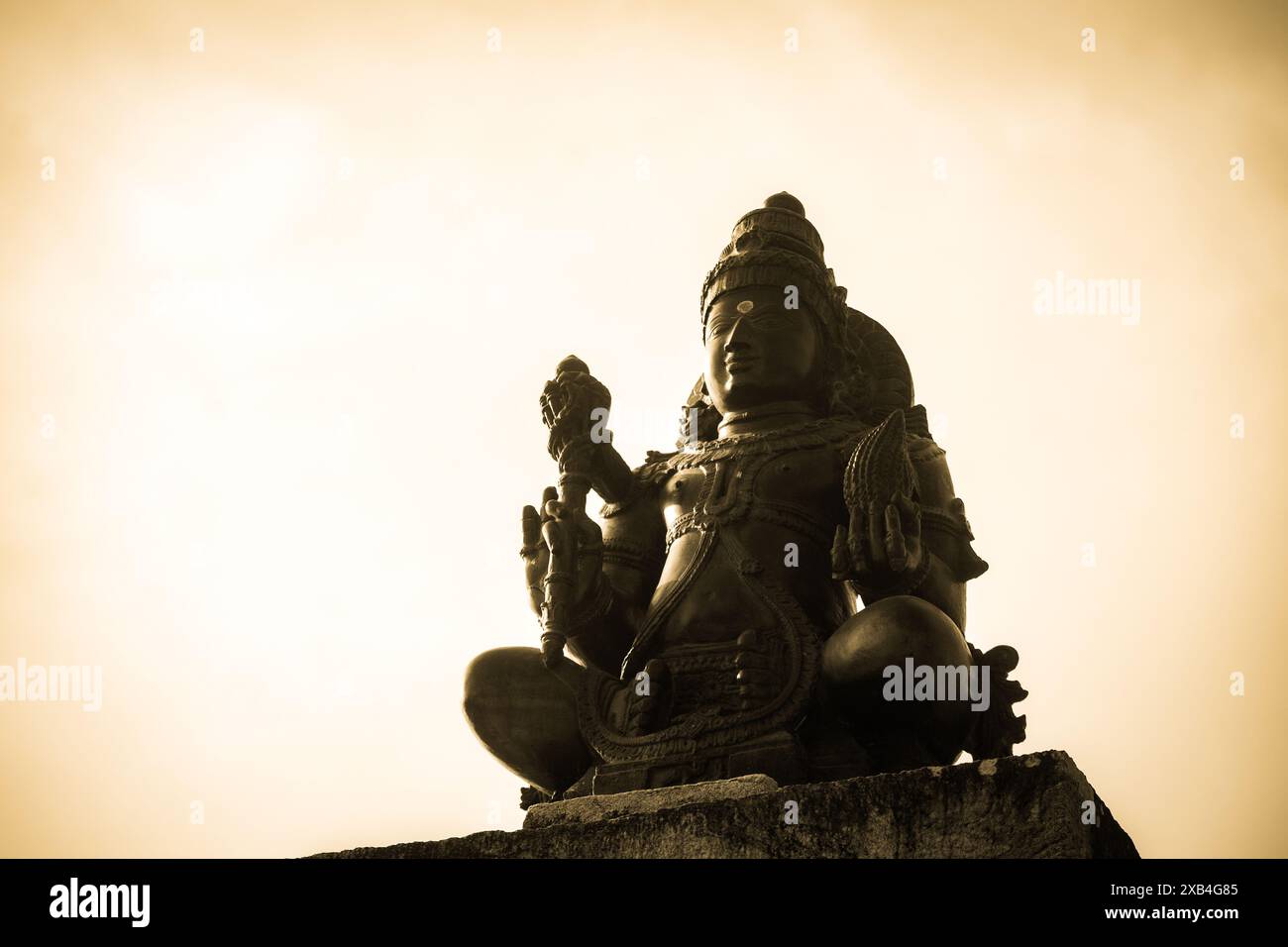 A large stone statue of the Hindu elephant deity Ganesha sits on the ...