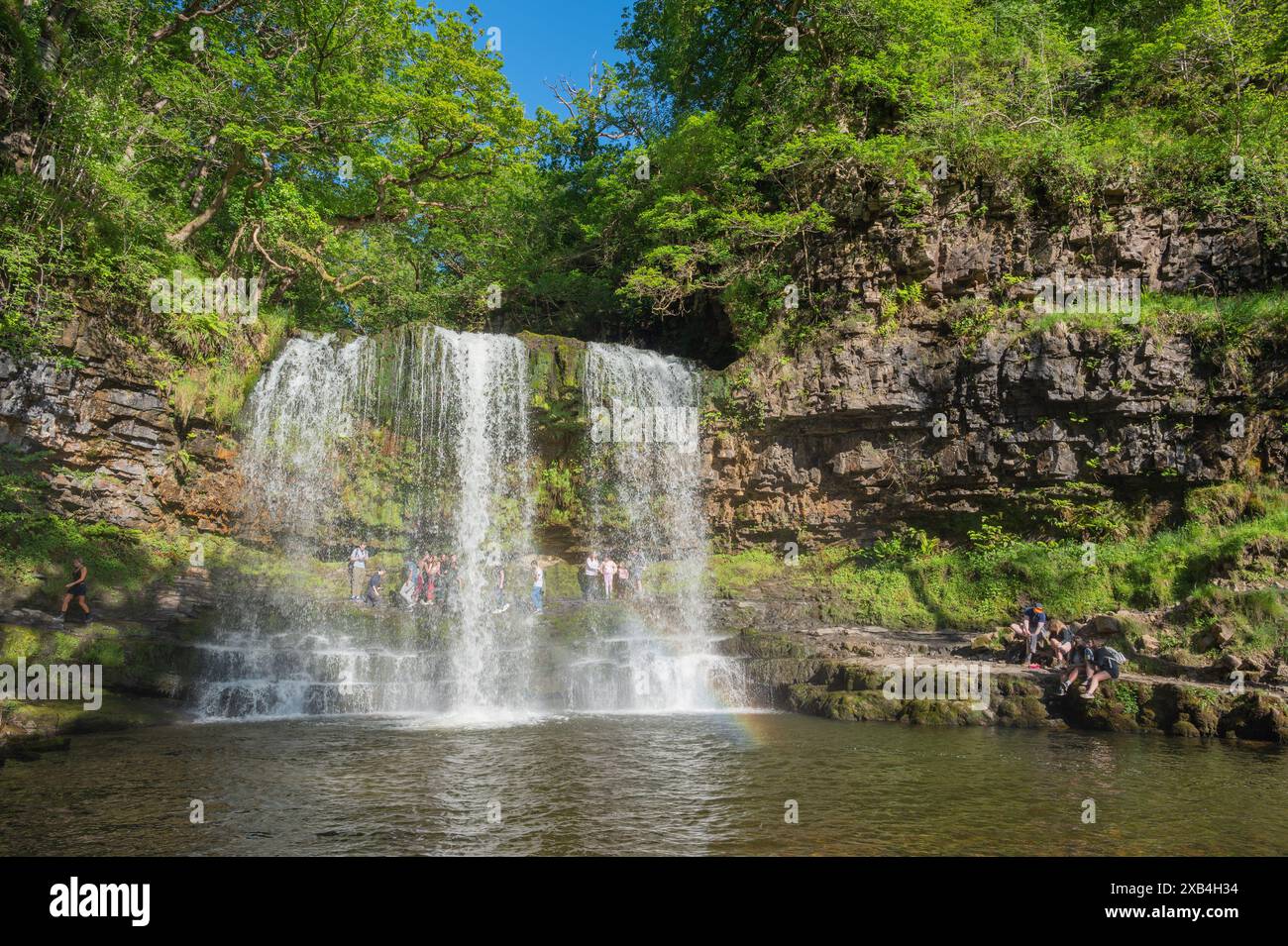 People behind Sgwd yr Eira waterfall, Afon Hepste, Waterfall Country ...